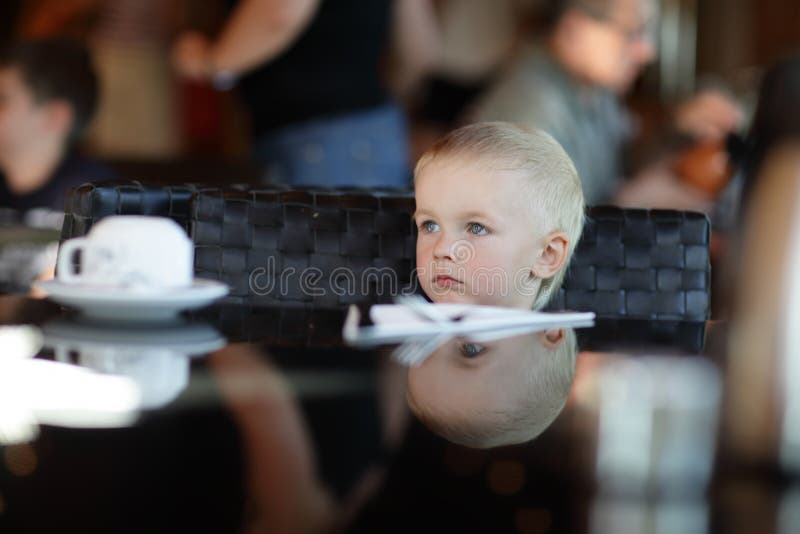 Child sitting at table stock image. Image of hungry, food - 26972857