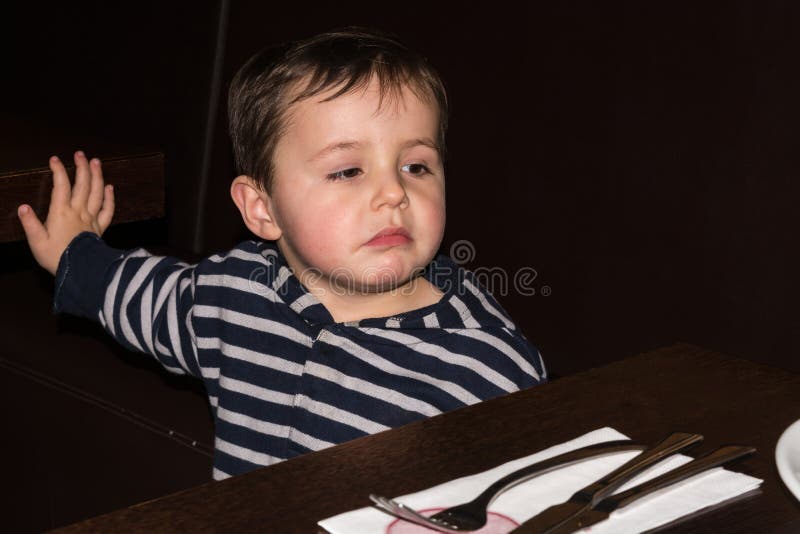 Child is sitting at table stock image. Image of gourmet - 94781425