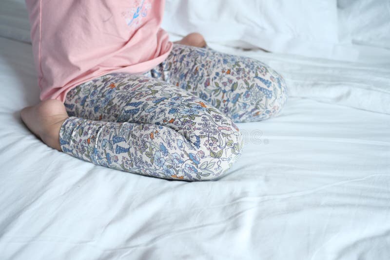 Child Sitting W Posture on Bed Stock Image - Image of look, posture ...