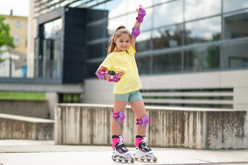 Child Skating on Roller-blades in Stadium Having Fun Stock Photo ...