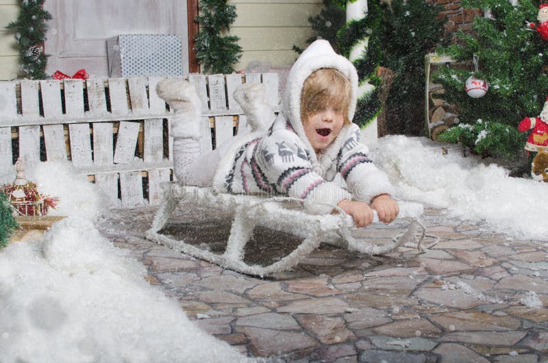 Child Sledding in Yard of Winter Snow Stock Image - Image of sled ...