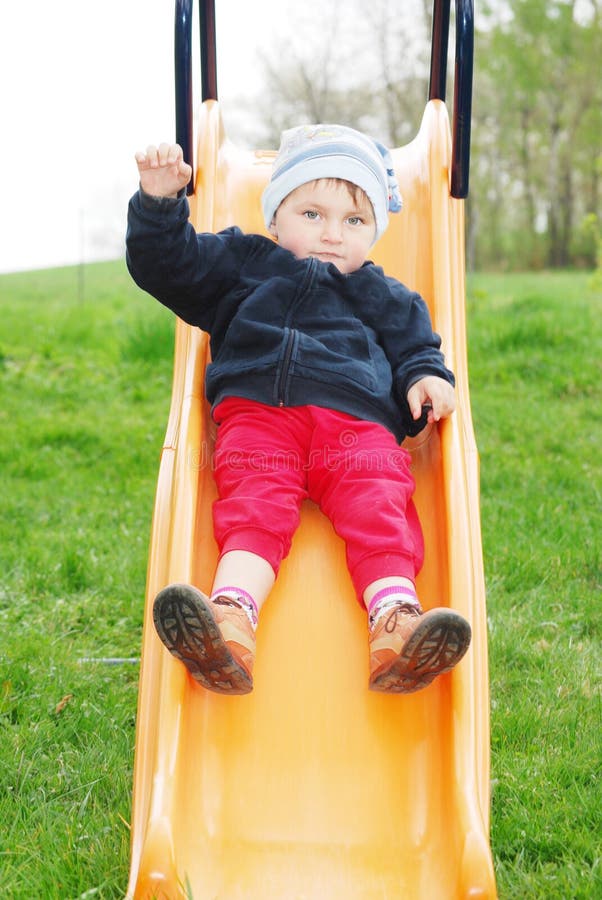 Child on a slide stock image. Image of outdoor, infant - 19883773