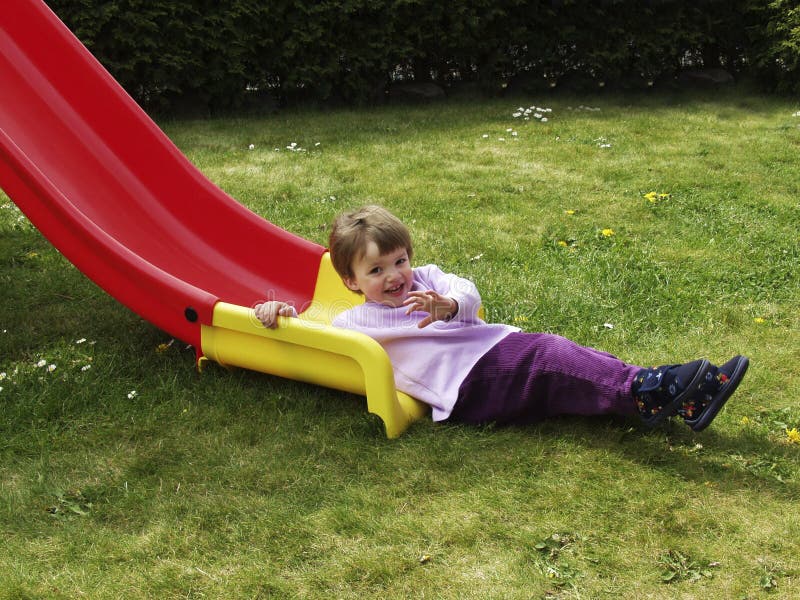 Child on a slide stock image. Image of full, brother, learn - 707739