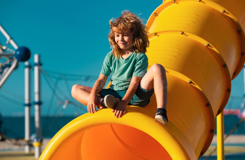 Child on Slide Playground Area. Funny Kids Face. Stock Image - Image of ...