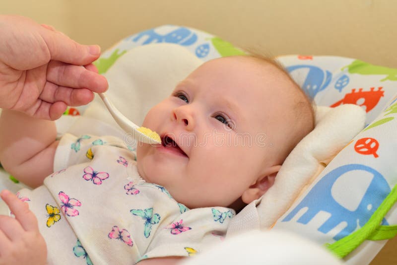 Mom Feeds the Child with Mashed Potatoes Stock Image - Image of feeding ...