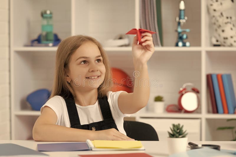 Child Smile and Play with Paper Plane in School Classroom Stock Image ...