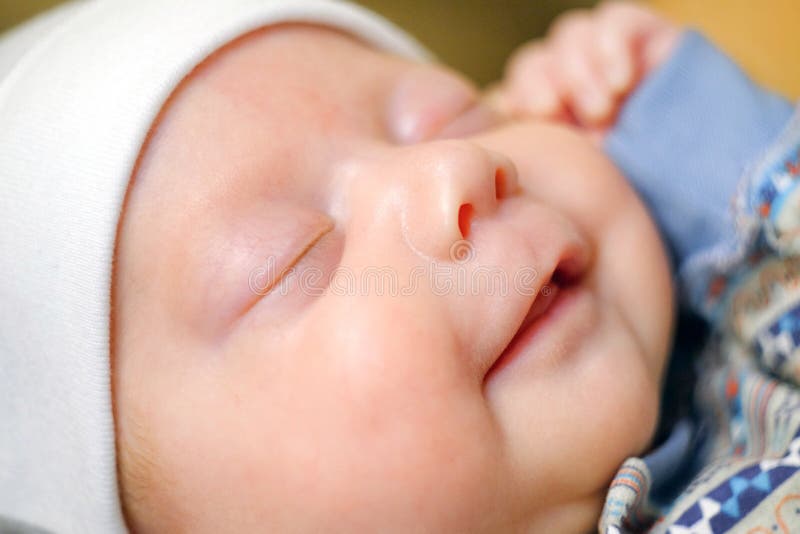 The Child Smiles in His Sleep. Good Dream. Stock Image - Image of ...