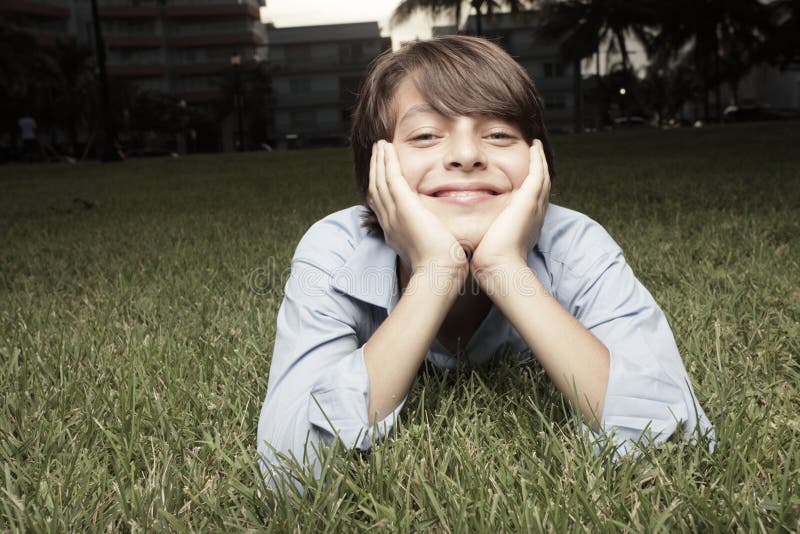 Child smiling in a field stock photo. Image of grass - 11096542