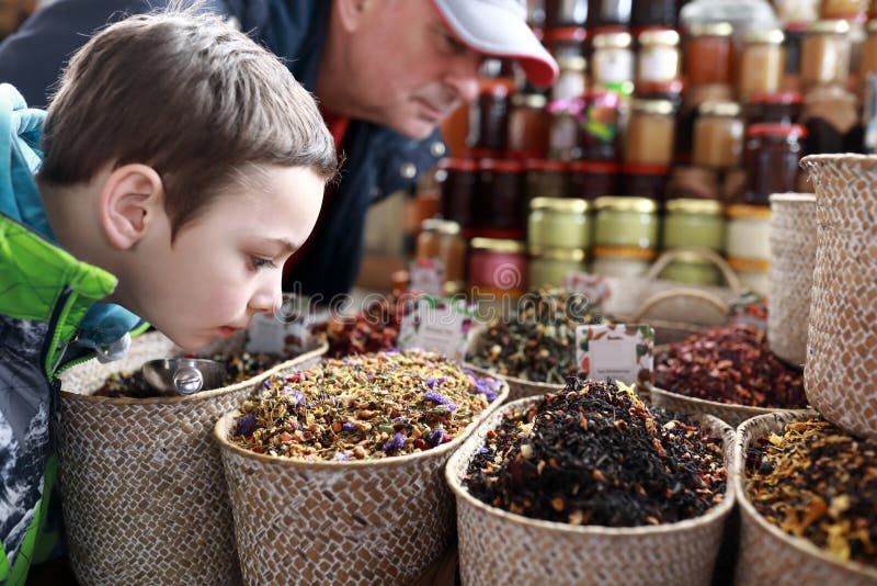Child sniffing herbal tea stock image. Image of aroma - 181878263
