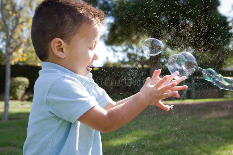675 Child Catching Bubbles Stock Photos - Free & Royalty-Free Stock ...