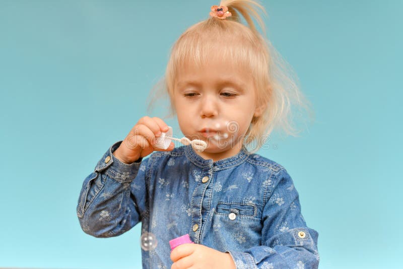 A Child with Soap Bubbles is Having Fun on His Holiday Stock Photo ...