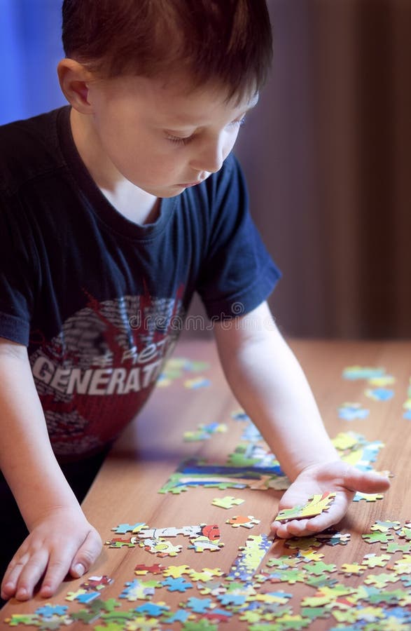 Child Solving a Puzzle - Education Stock Image - Image of years ...