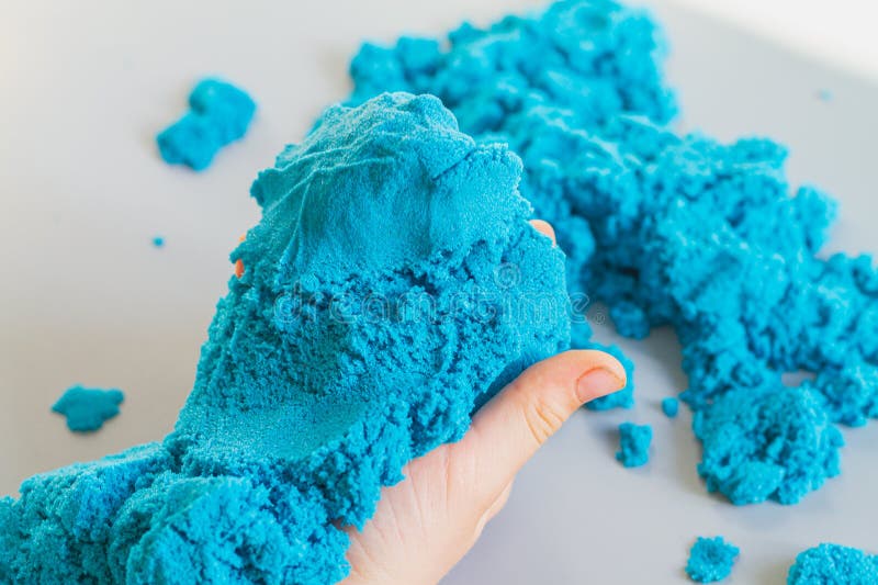 The Child Sorts the Blue Kinetic Sand with His Fingers, Develops Motor ...