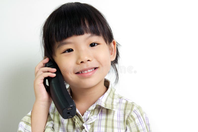 Two kids talking on phone stock photo. Image of room - 29149634