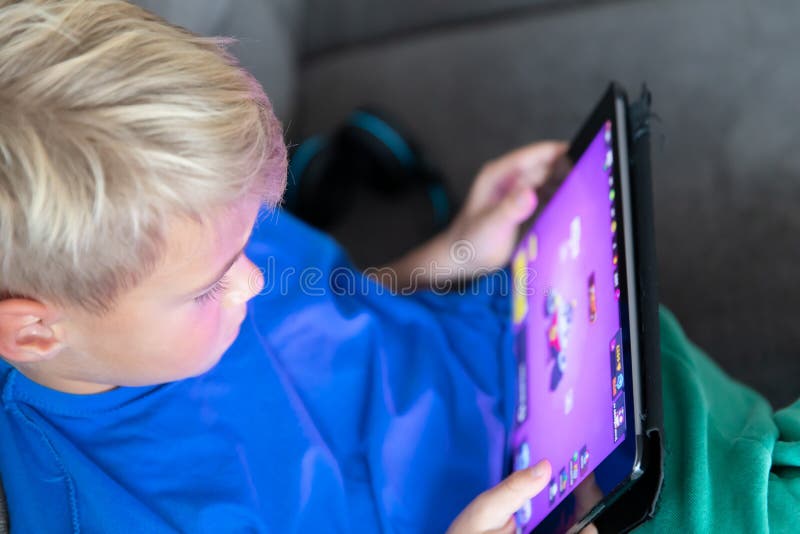 Little Boy Playing on Tablet Stock Photo - Image of caucasian ...