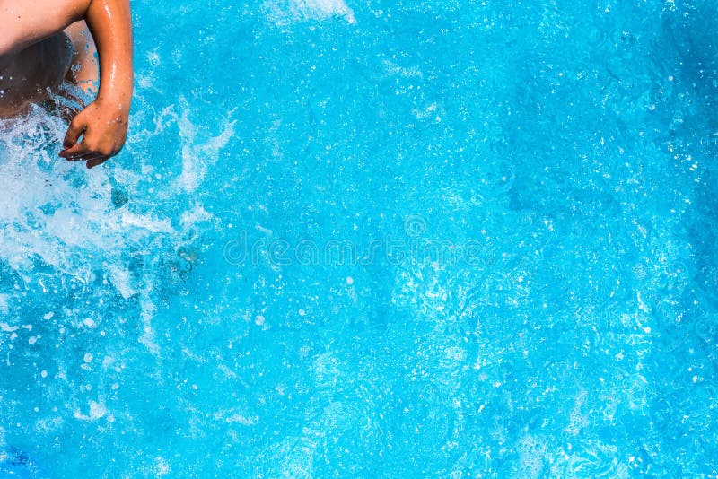 Child Splashing in the Cool Water of a Pool in Summer Stock Photo ...