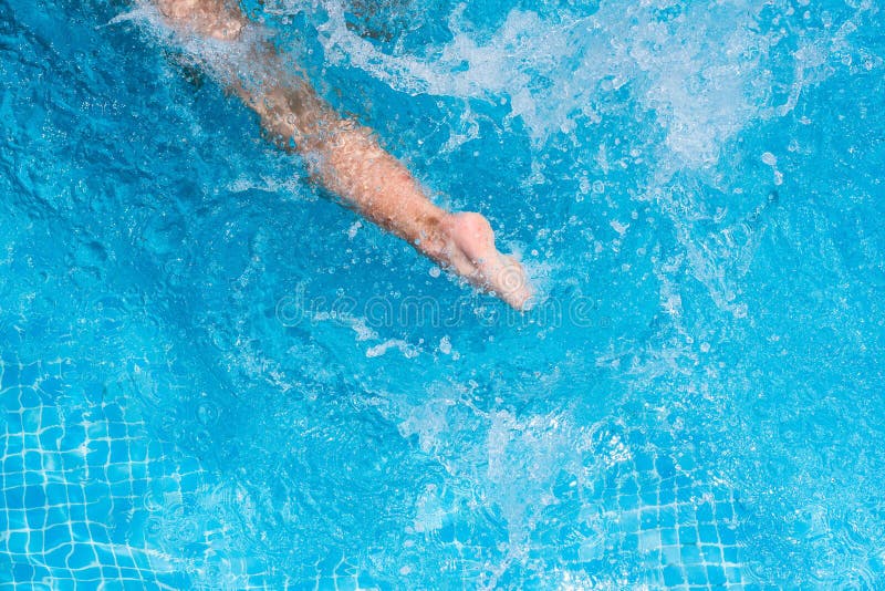Child Splashing in the Cool Water of a Pool in Summer Stock Image ...