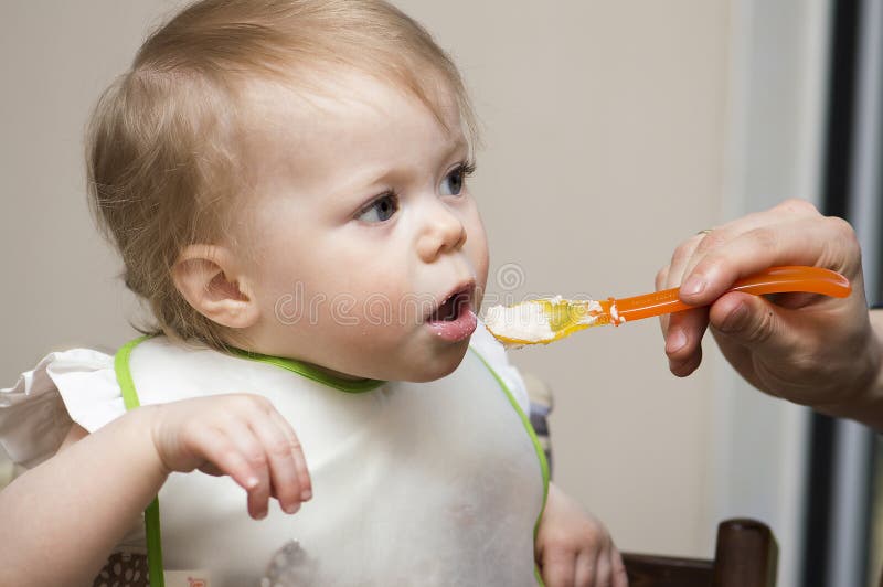 Child spoon-feed. stock photo. Image of motherhood, funny - 41563194