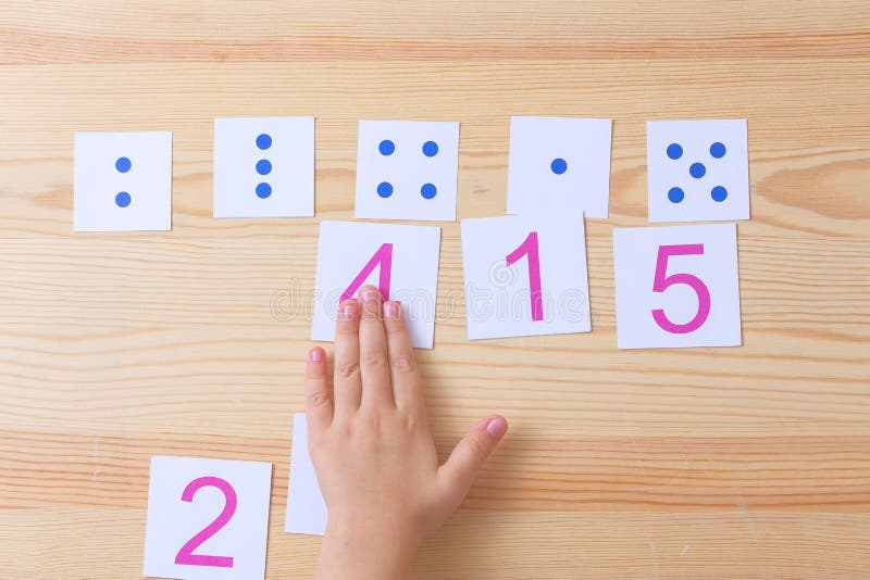 The Child Spreads Cards with Numbers To Cards with Dots. the Study of ...