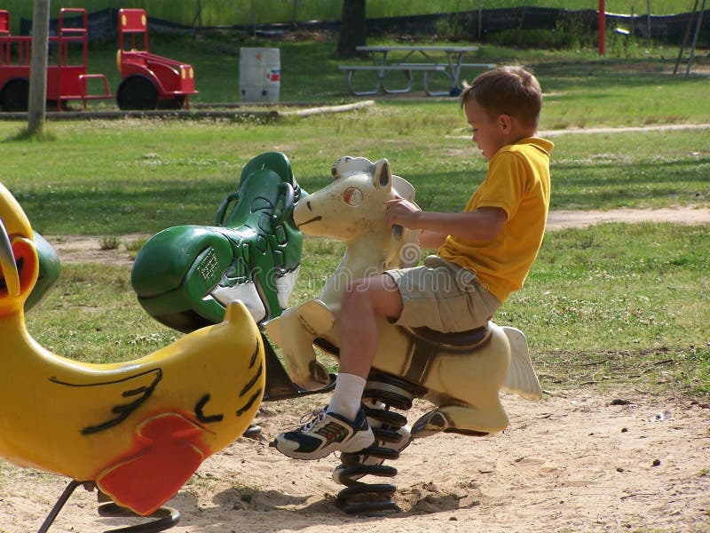 Child on Spring Horse stock photo. Image of little, playground - 123004