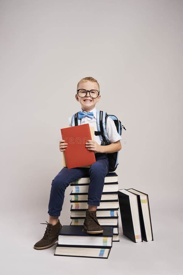 Child among a Stack of Books Stock Image - Image of books, elementary ...