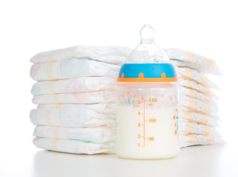 Child Stack of Diapers and Baby Feeding Bottle with Milk Stock Photo ...