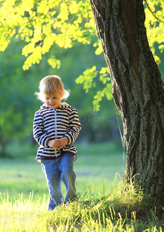 Child Stand at a Tree in Autumn Stock Photo - Image of girl, blond ...