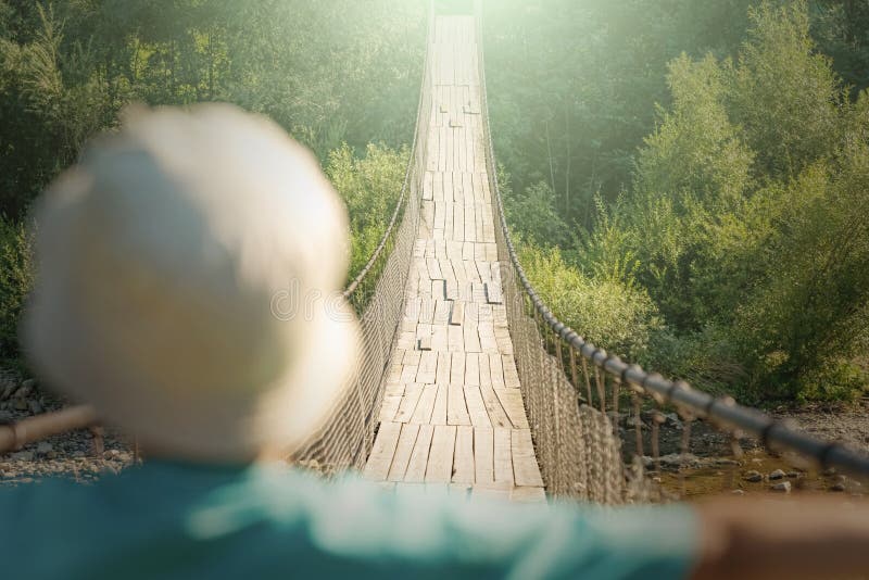 The Child is Standing at the Beginning of the Suspension Bridge ...