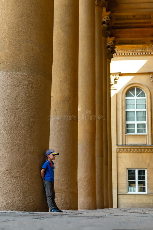 The Child is Standing by a Column Stock Photo - Image of pillar, space ...