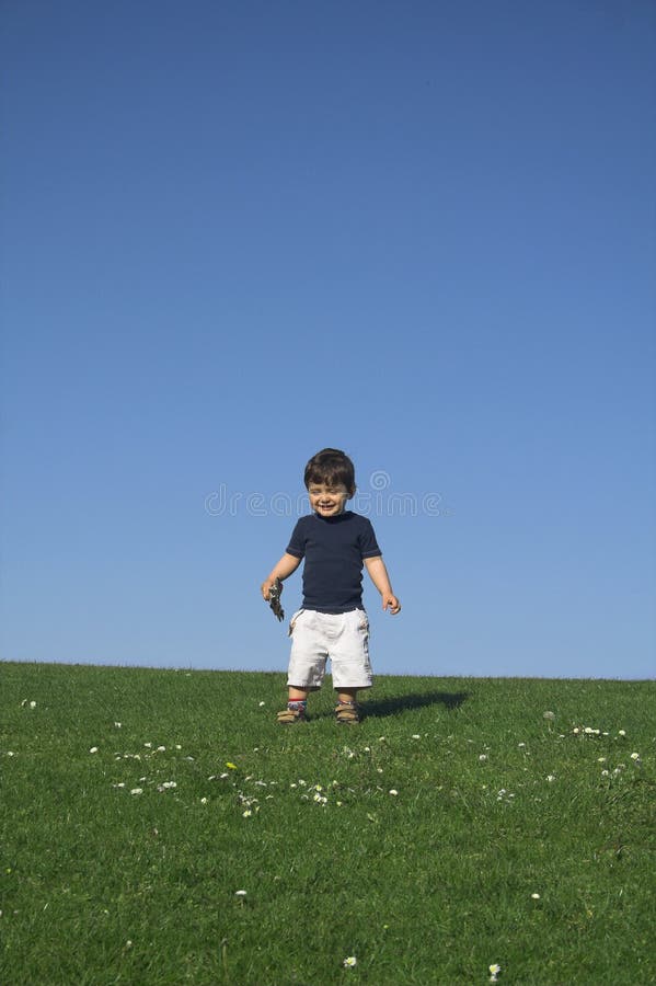 Child standing in field stock image. Image of airplane - 2467357