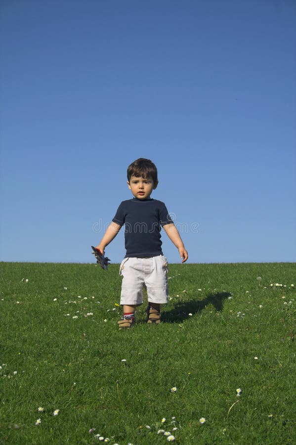 Child standing in field stock photo. Image of healthy - 2467368