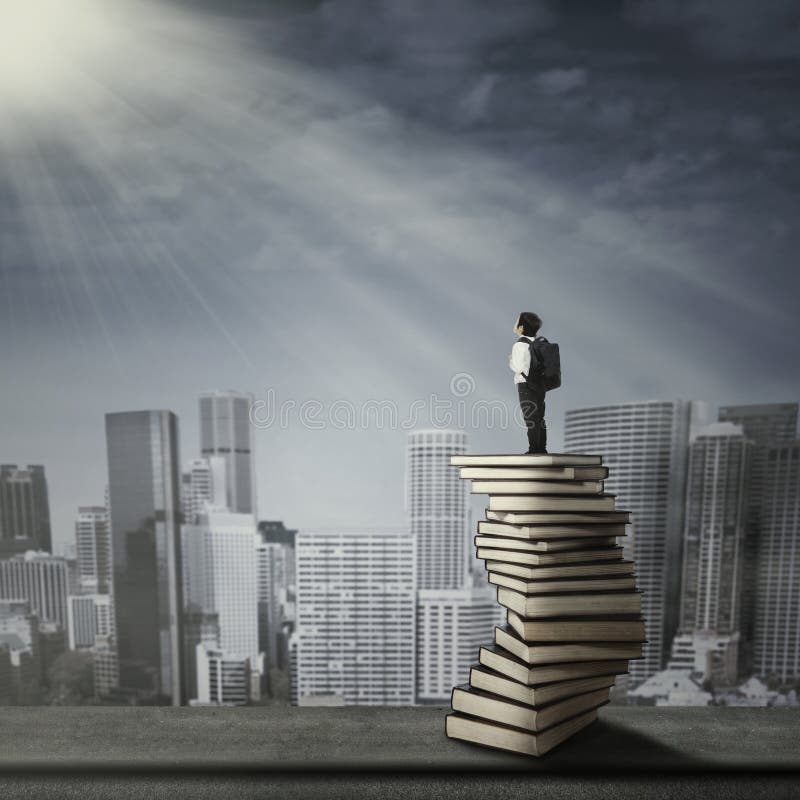 Child Standing on a Stack of Books Stock Photo - Image of education ...