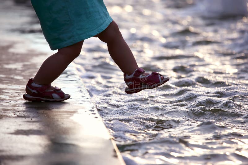 Child steps into the water stock image. Image of steps - 121897809