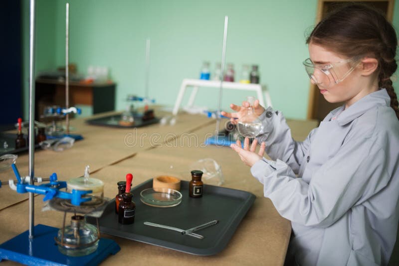 Child Student in the Chemistry Room. Exciting Experiments and ...