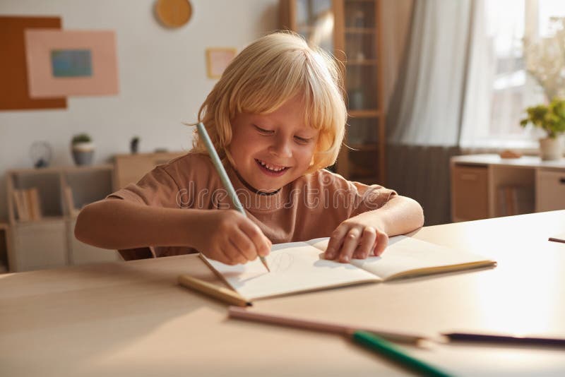 Child studying at home stock photo. Image of boys, smiling - 198966974