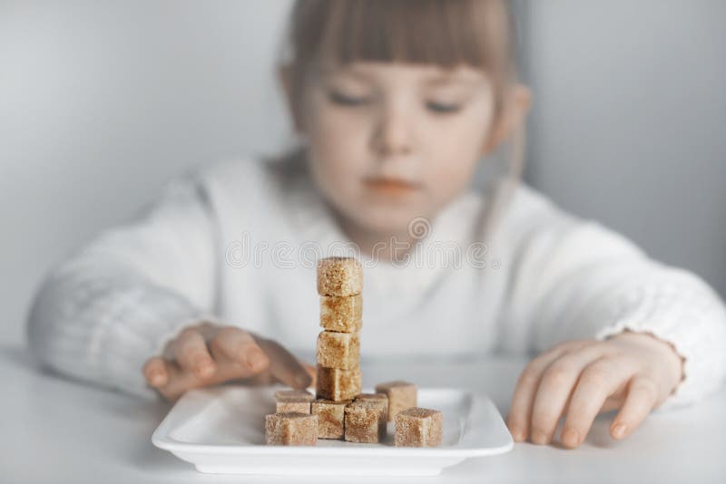 Child, Sugar Cubes. the Problem of Excessive Consumption of Sugar by ...