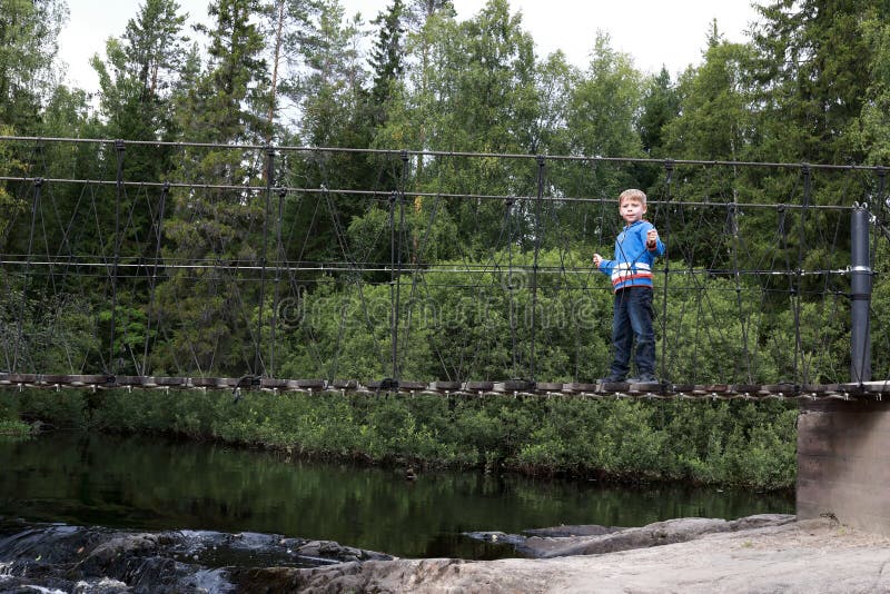 Child on Suspension Bridge Over Ruskeala Waterfall Stock Image - Image ...