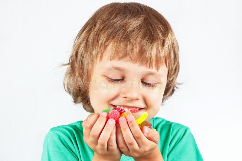 Smiling Boy with Sweets and Candies on White Background Stock Image ...
