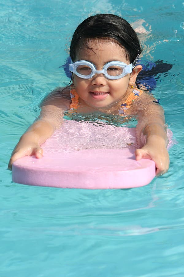 Child kicking in pool stock image. Image of splash, water - 1406951