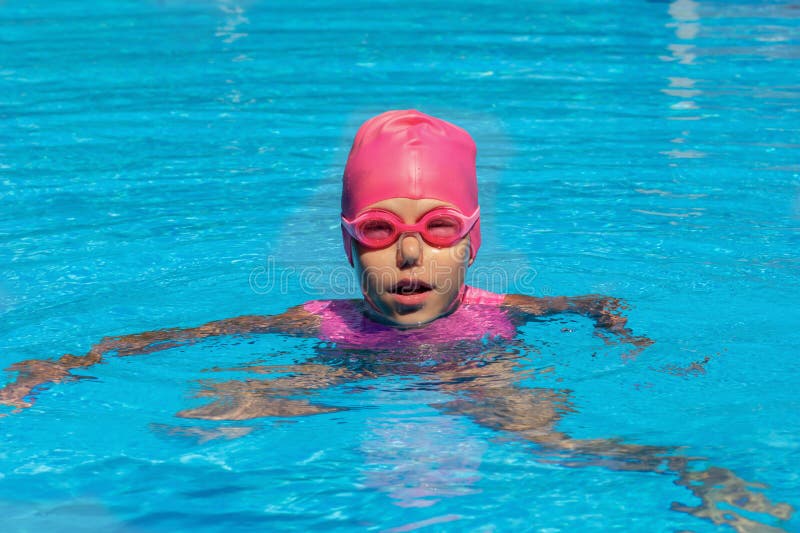 Child in Swimming Cap, Goggles and Nose Clip in Swimming Pool Stock ...