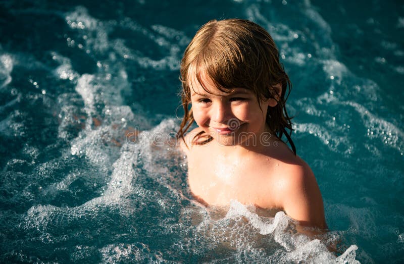 Child Swimming in Pool Play with Floating Ring. Smiling Cute Kid in ...