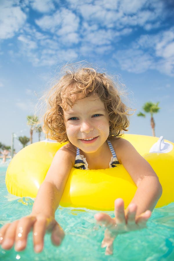 Child in swimming pool stock photo. Image of leisure - 31341842