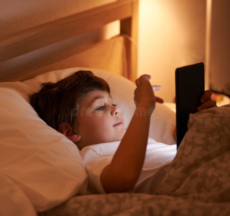 Child, Tablet and Bedroom with Night, Smile and Technology for Social ...