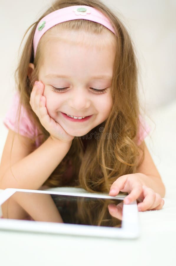Child with tablet computer stock image. Image of happiness - 33123339