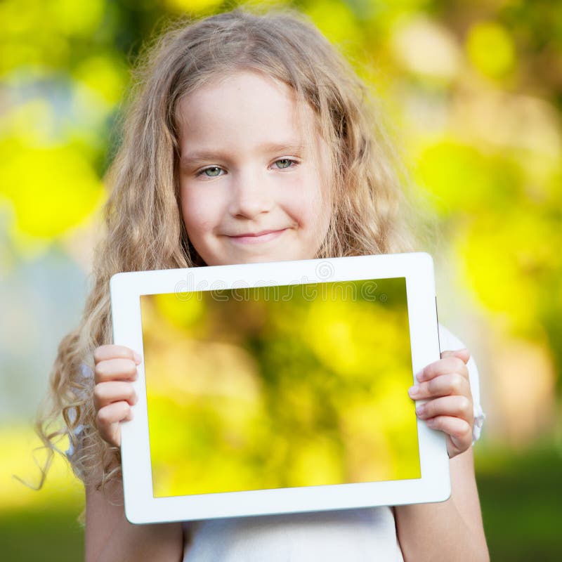 Child with tablet computer stock image. Image of meadow - 31880921
