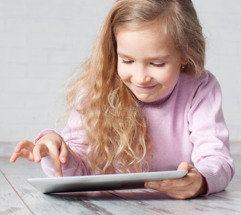 Child with tablet pc stock photo. Image of laptop, head - 165241702