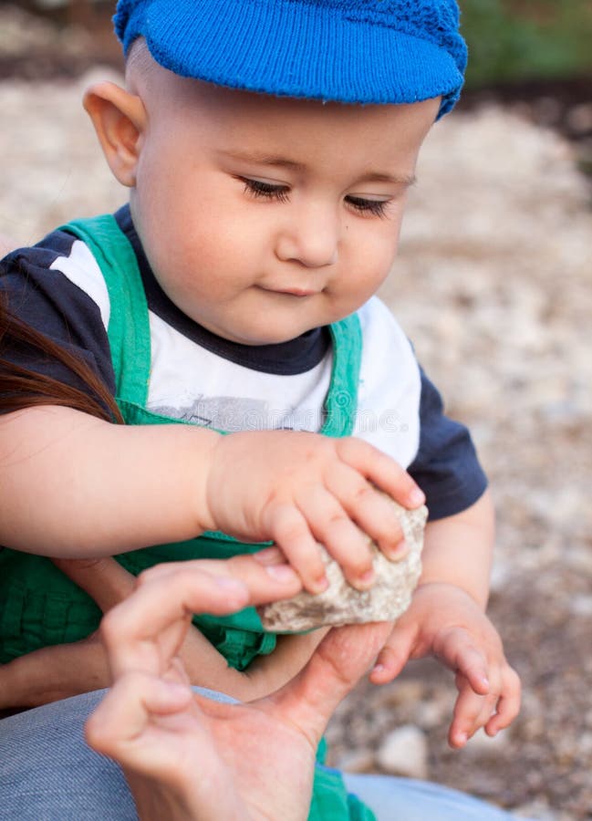 Child Takes Stone Mother Hand Stock Photos - Free & Royalty-Free Stock ...