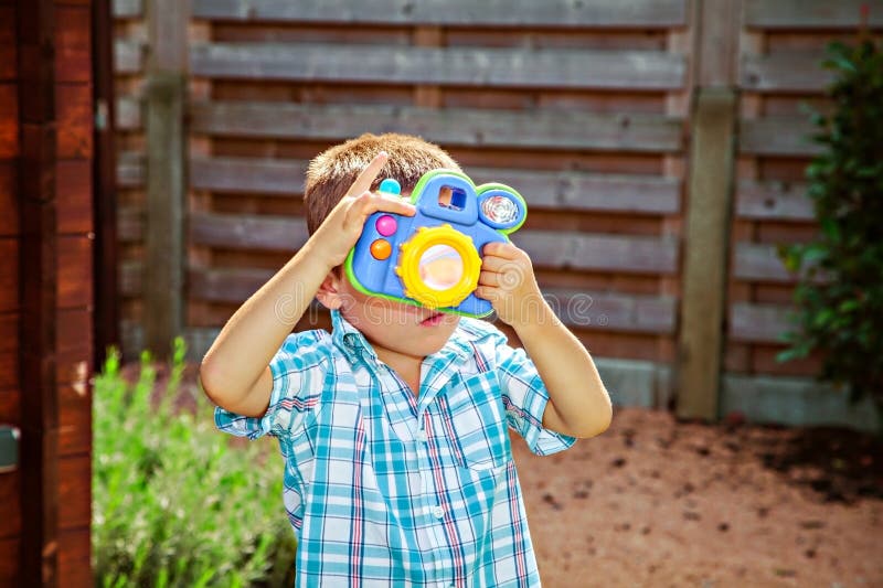 Child taking photos stock image. Image of male, aiming - 39012873