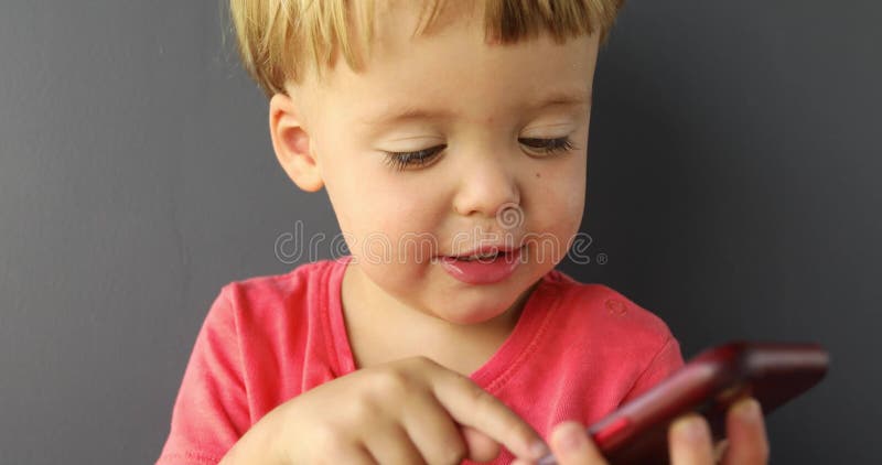Child Tapping Cell Phone Screen, Interest in Modern Technology Stock ...