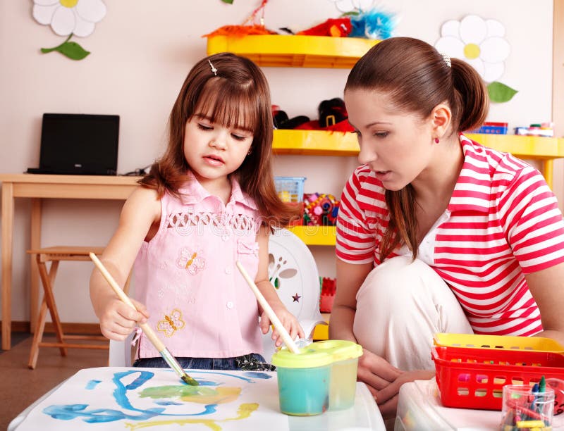 Child with Teacher in Play Room Draw Paint . Stock Photo - Image of ...